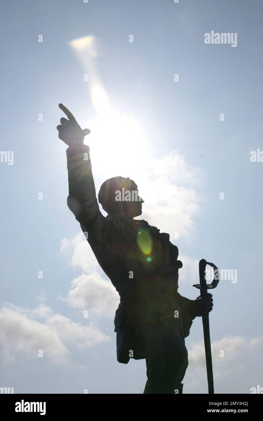 Hero figure pointing in a direction Stock Photo - Alamy