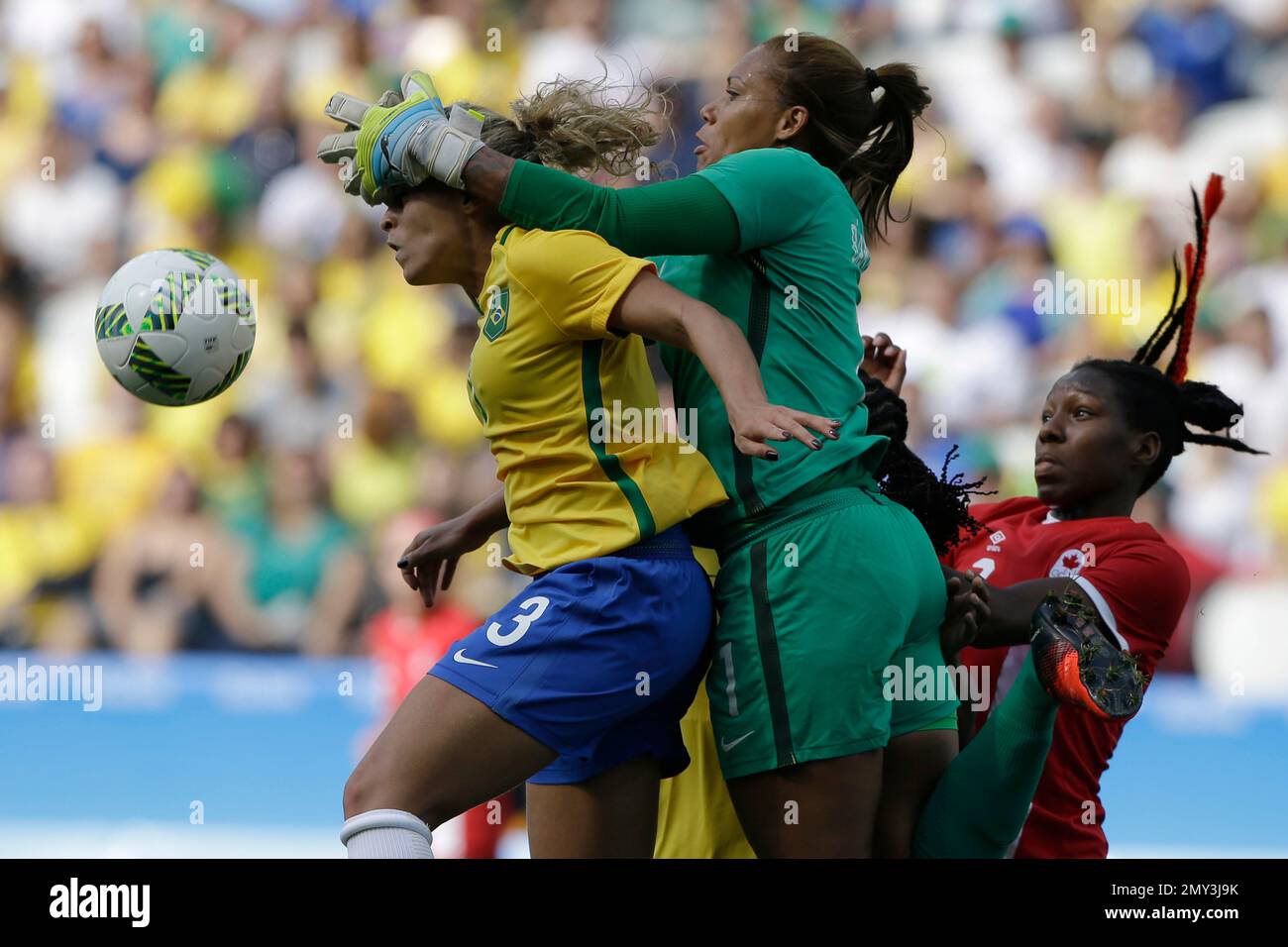 Brazil goalkeeper Barbara, center, fails to grabs the ball as her ...