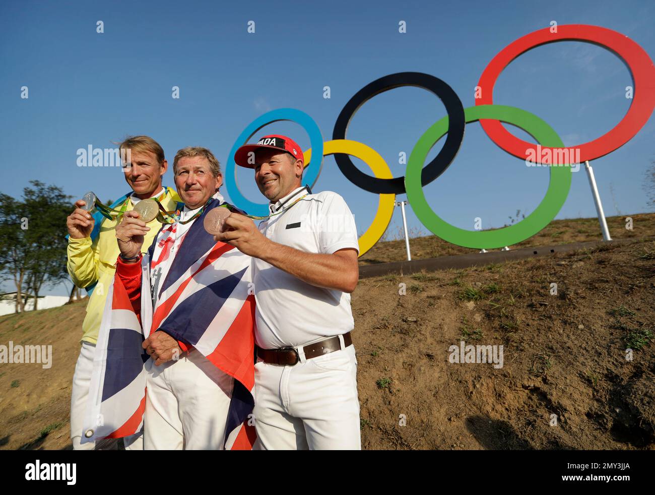 From left, silver medalist Sweden's Peder Fredricson, gold medalist ...