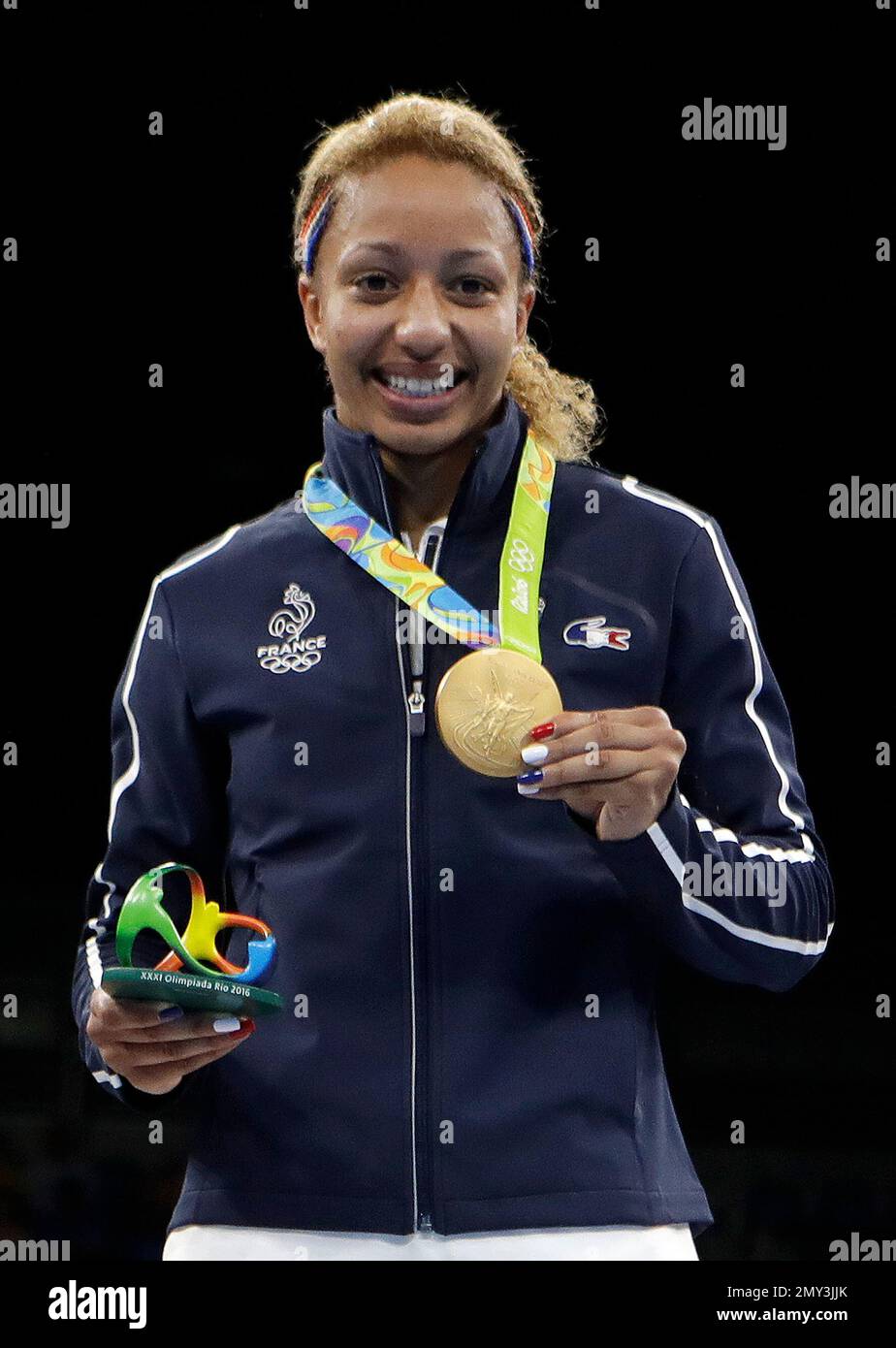 France's Estelle Mossely displays her gold medal for the women's ...