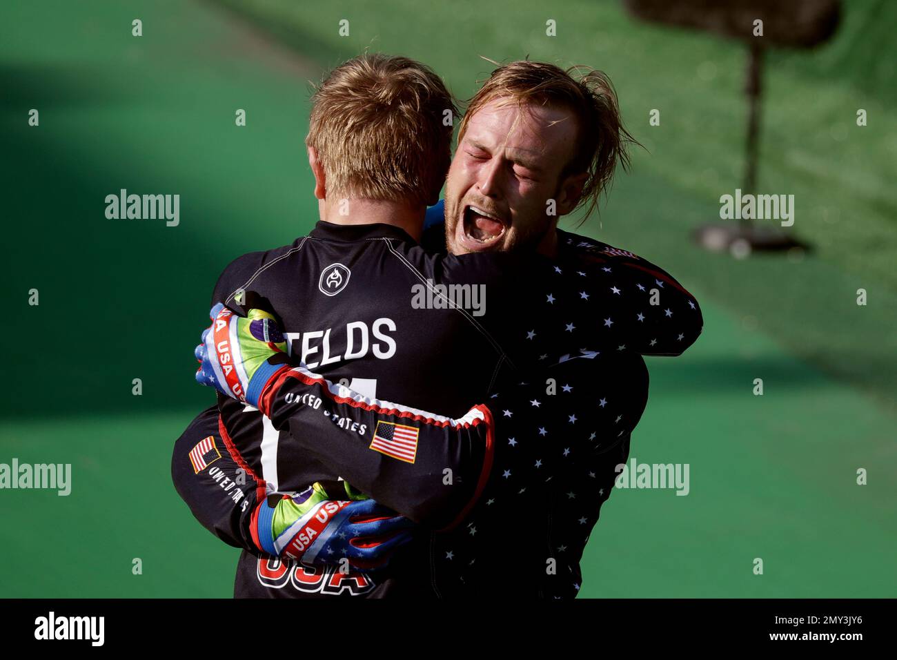 Fourth placed Nicholas Long, right, hugs first placed Connor Fields ...