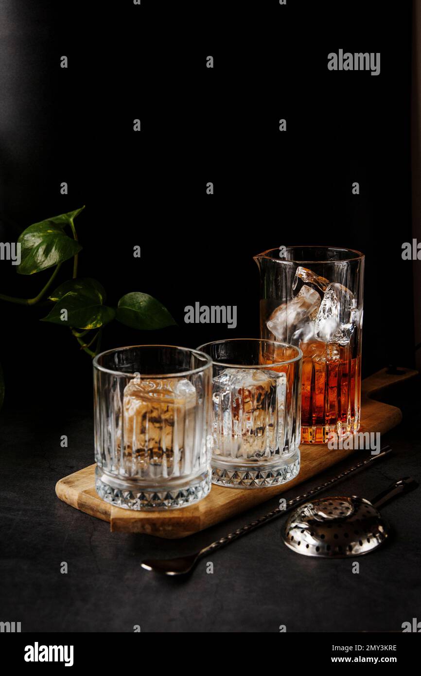 Negroni Cocktail Drink on black background and bartending tools Stock ...