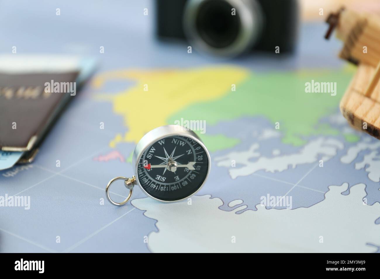 Compass and different items on world map. Trip planning Stock Photo - Alamy