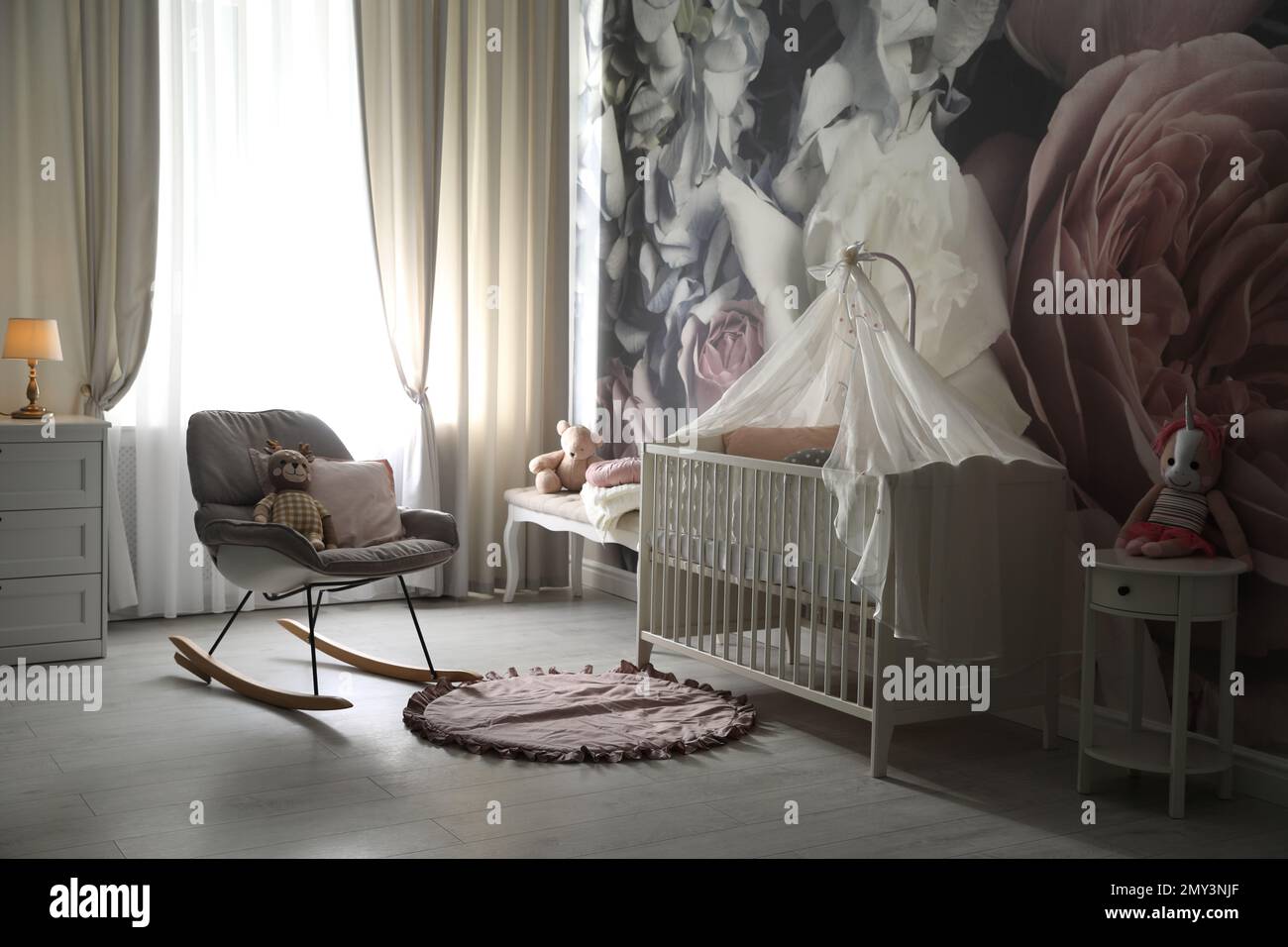 Baby room interior with stylish crib and floral wallpaper Stock Photo ...