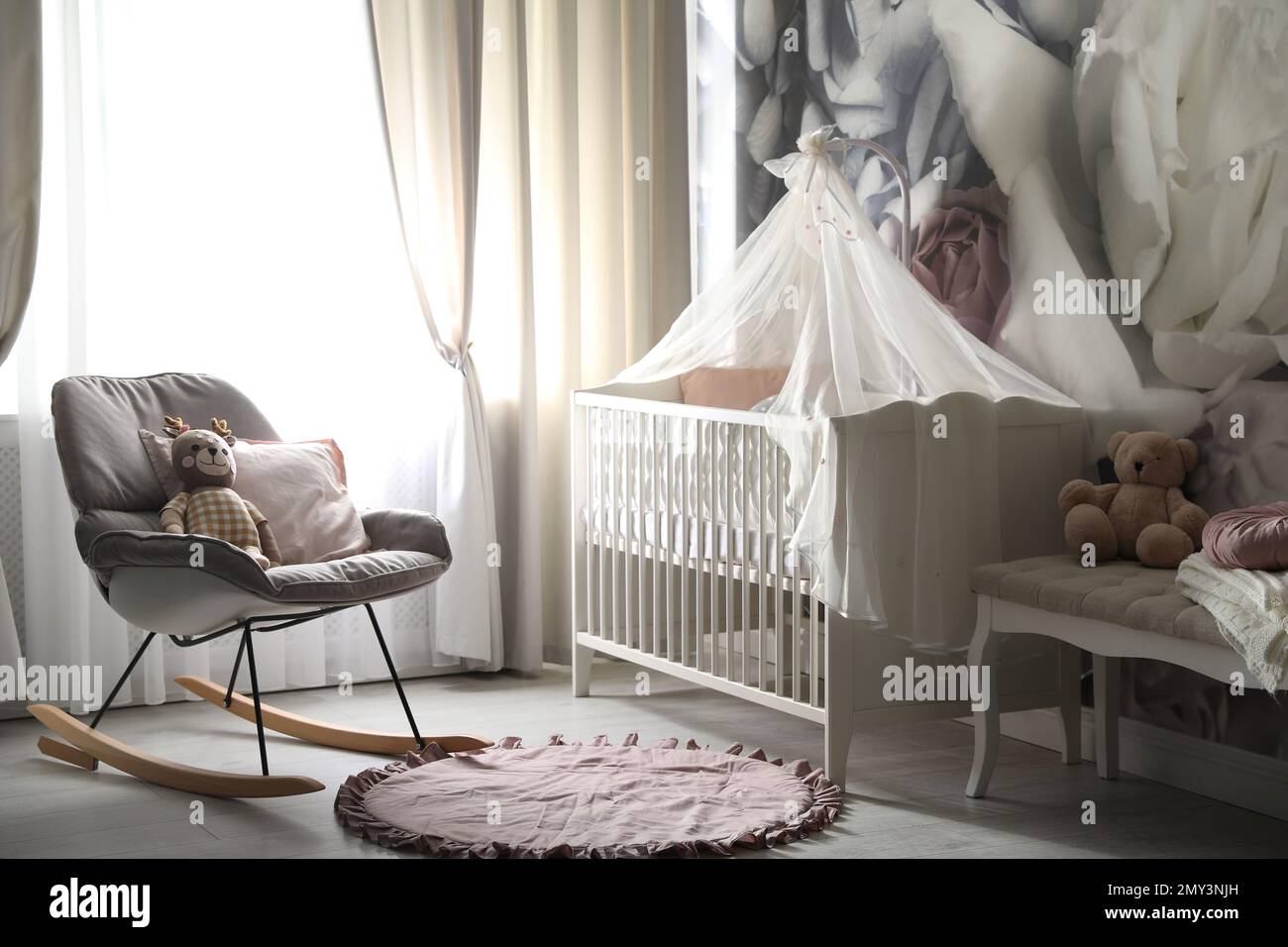 Baby room interior with stylish crib and floral wallpaper Stock Photo ...