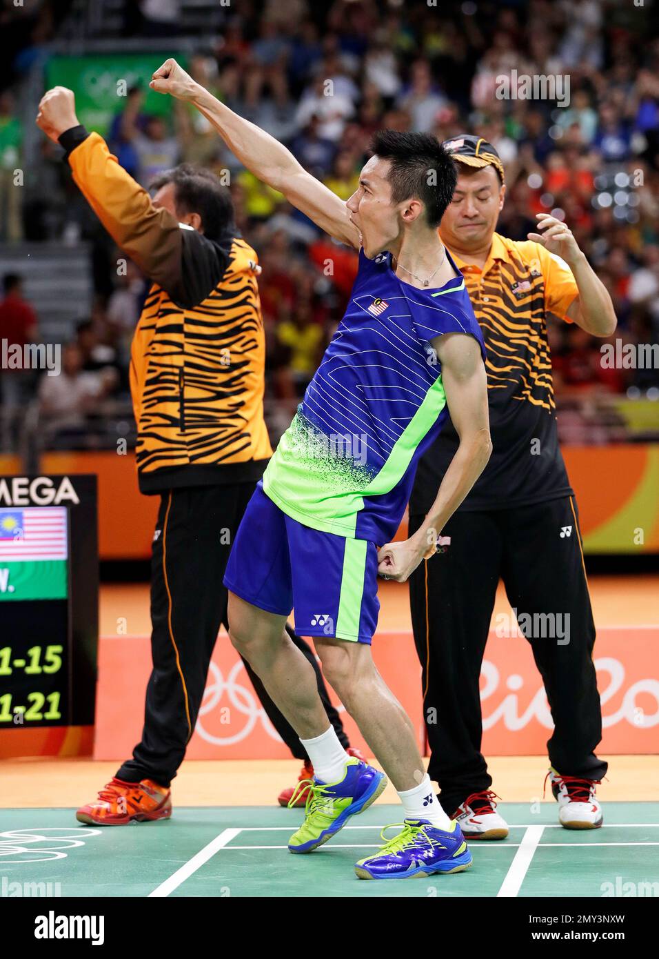 Malaysia's Lee Chong Wei celebrates with his coaches after defeating ...