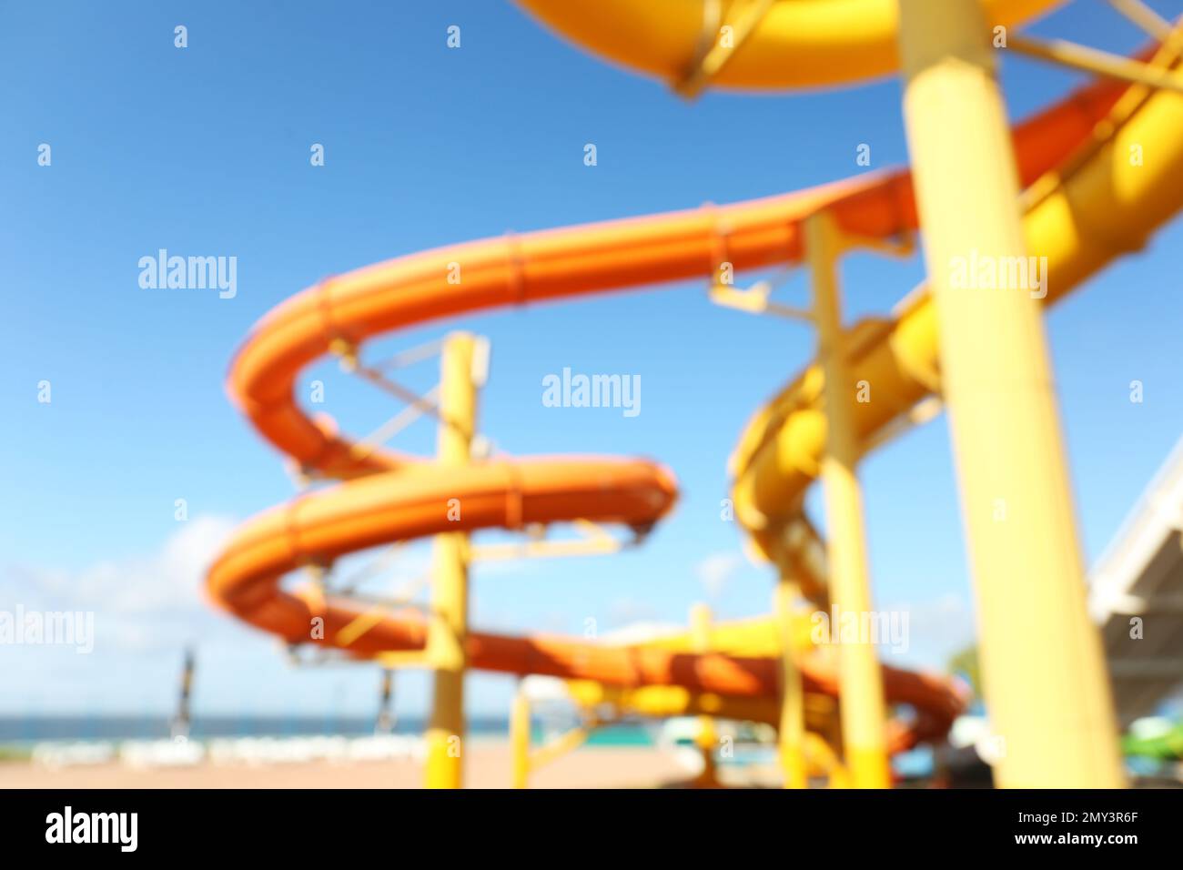 Different colorful slides in water park, blurred view Stock Photo - Alamy