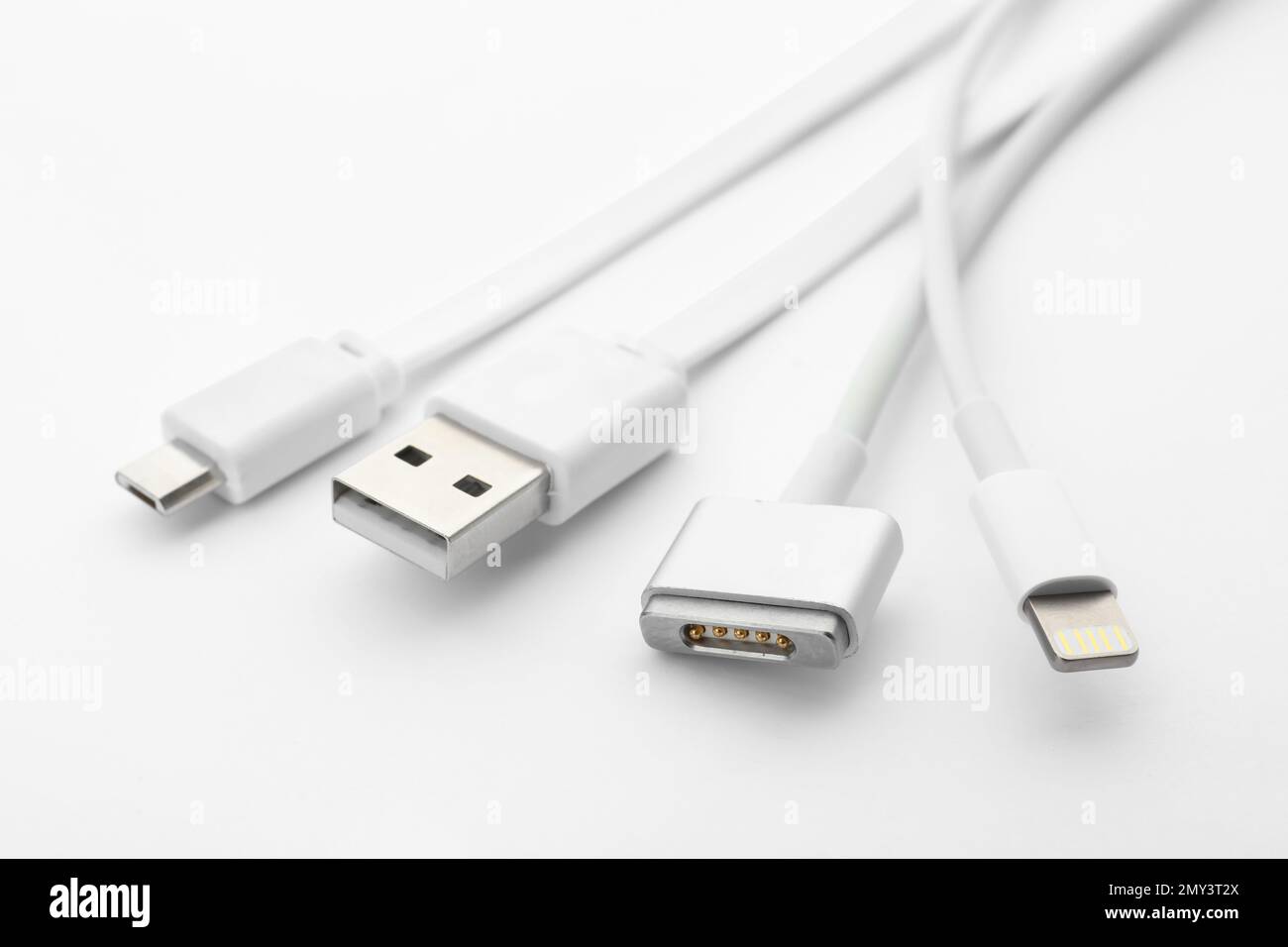 Charge cables on white background. Modern technology Stock Photo - Alamy