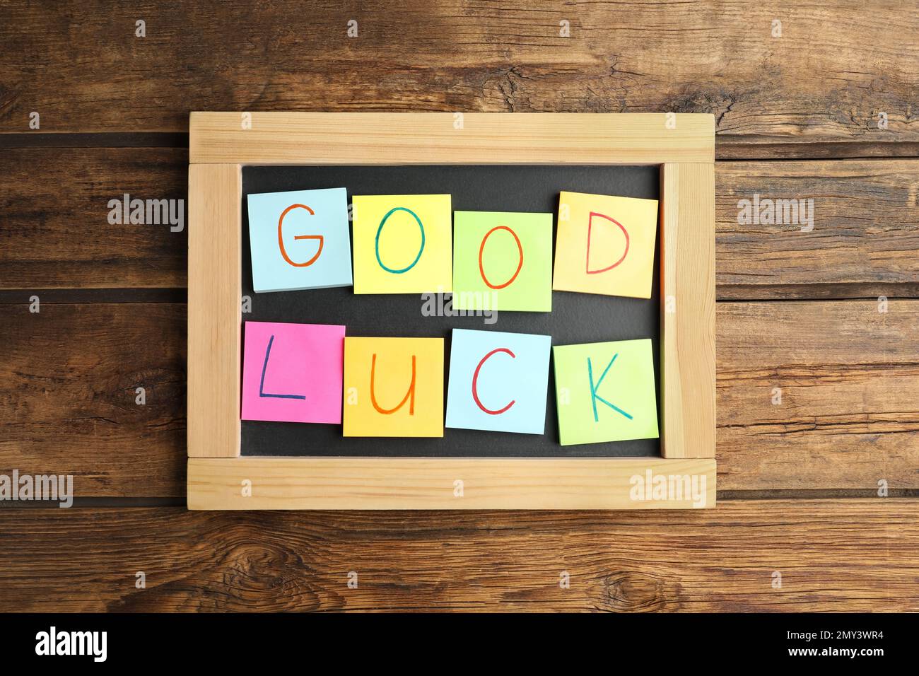 Notes with phrase GOOD LUCK on wooden background, top view Stock Photo ...