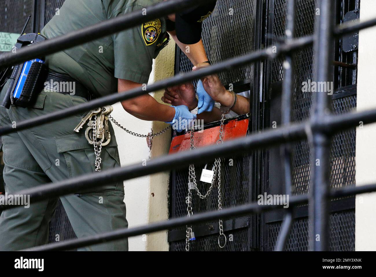 Handcuffs are removed from a condemned inmate after he returned to his ...