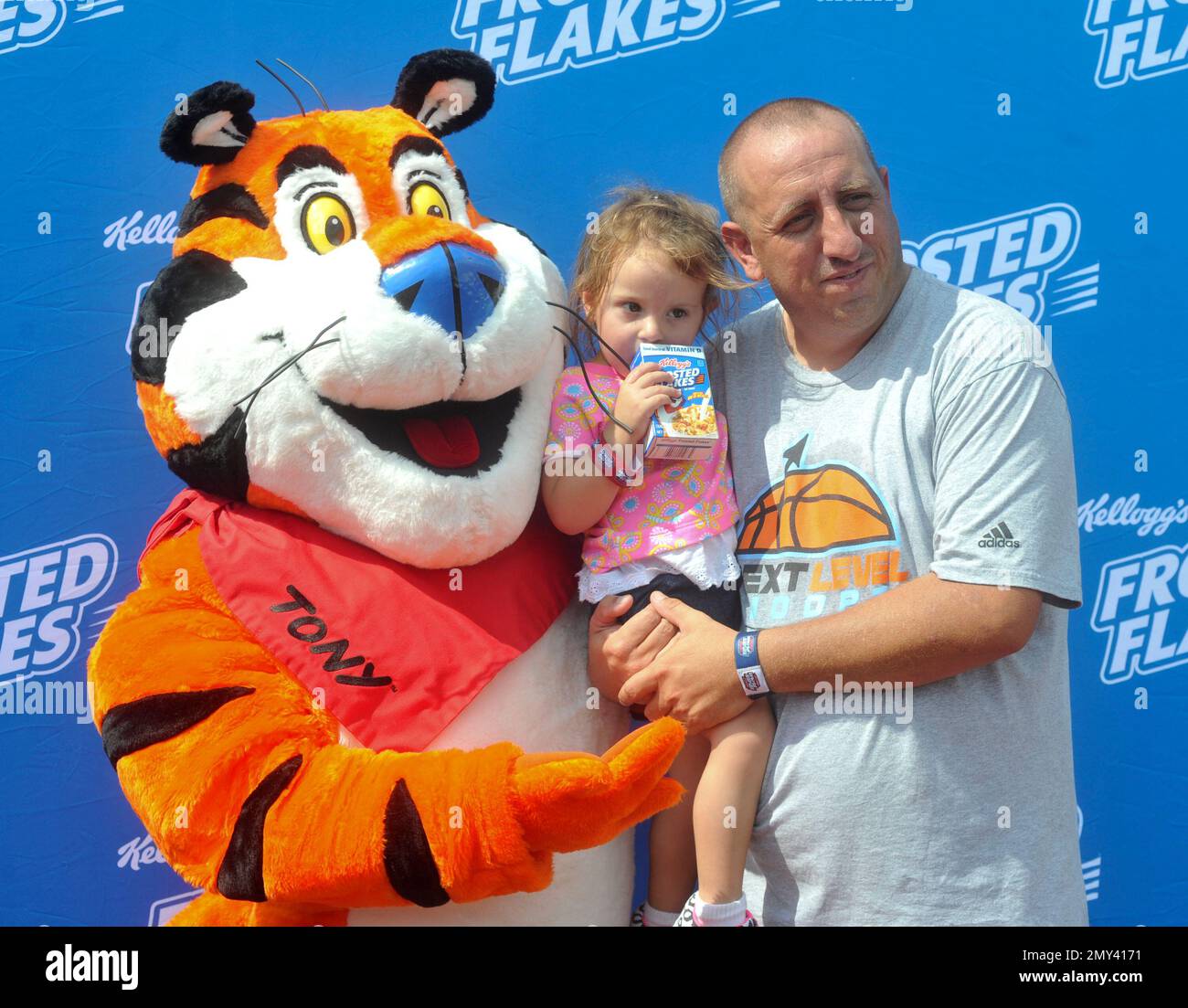 IMAGE DISTRIBUTED FOR KELLOGG’S FROSTED FLAKES - Tony the Tiger poses with Robert Swope and his ...