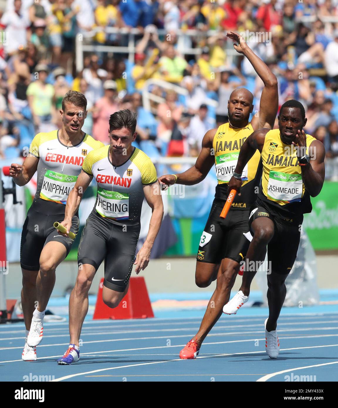 Jamaica's Nickel Ashmeade, right, takes the baton from Asafa Powell as ...