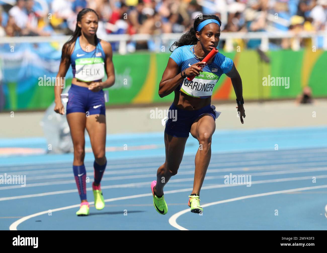 United States' Allyson Felix, left, looks on as English Gardner runs ...