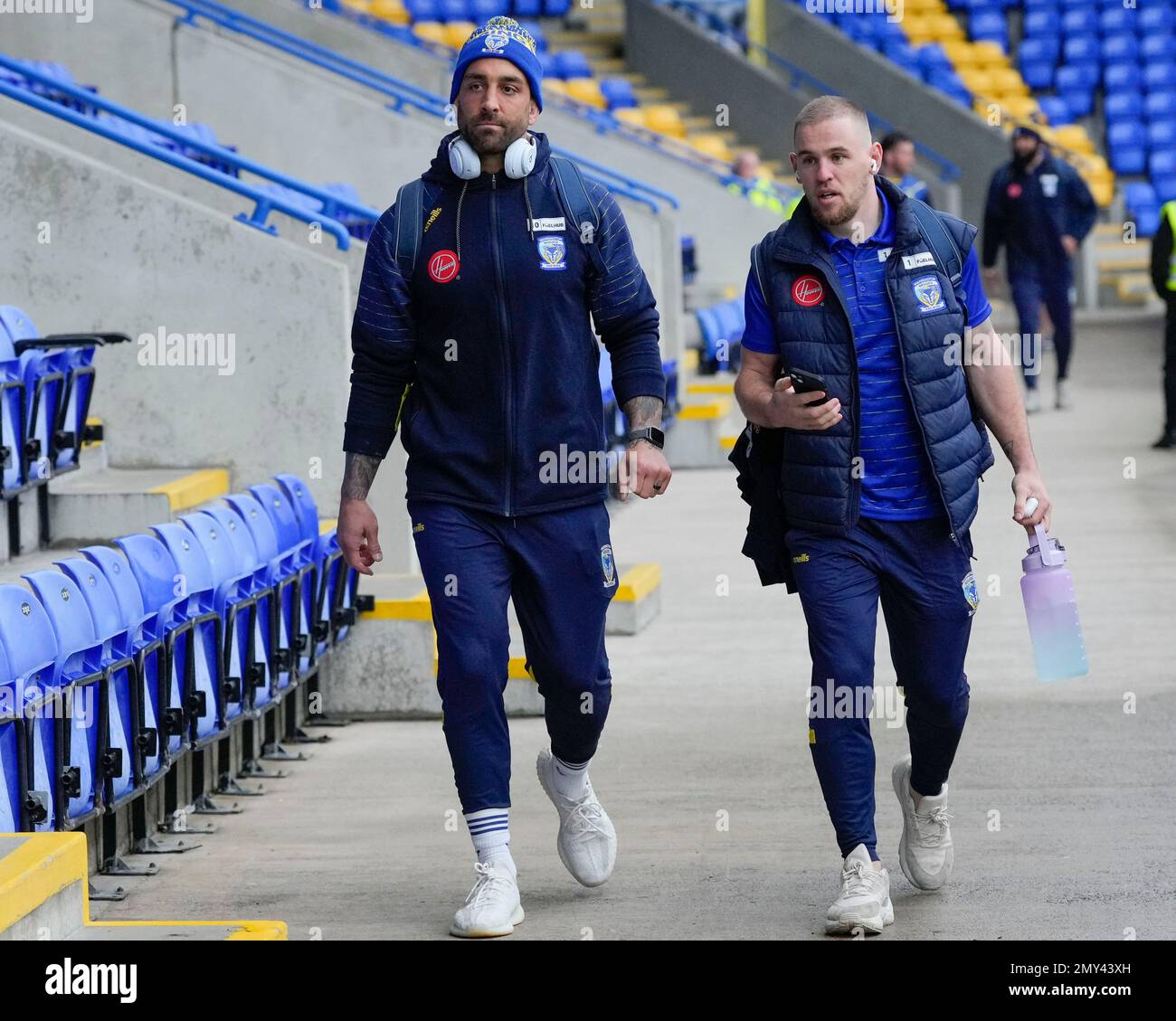 Paul Vaughan #10 and Matt Dufty #1 of Warrington Wolves arrive at the ...