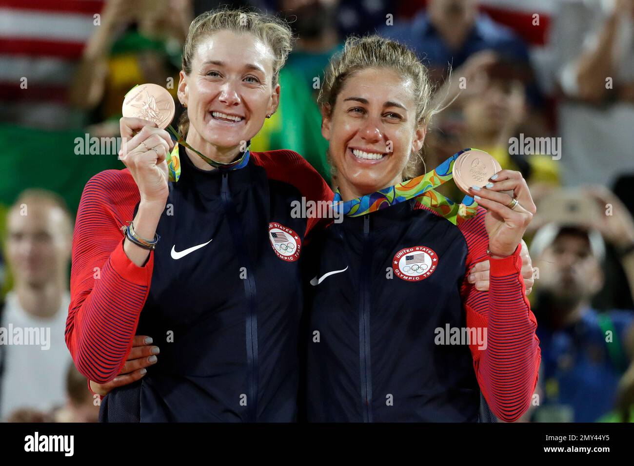 United States' Kerri Walsh Jennings, left teammate April Ross stand on ...