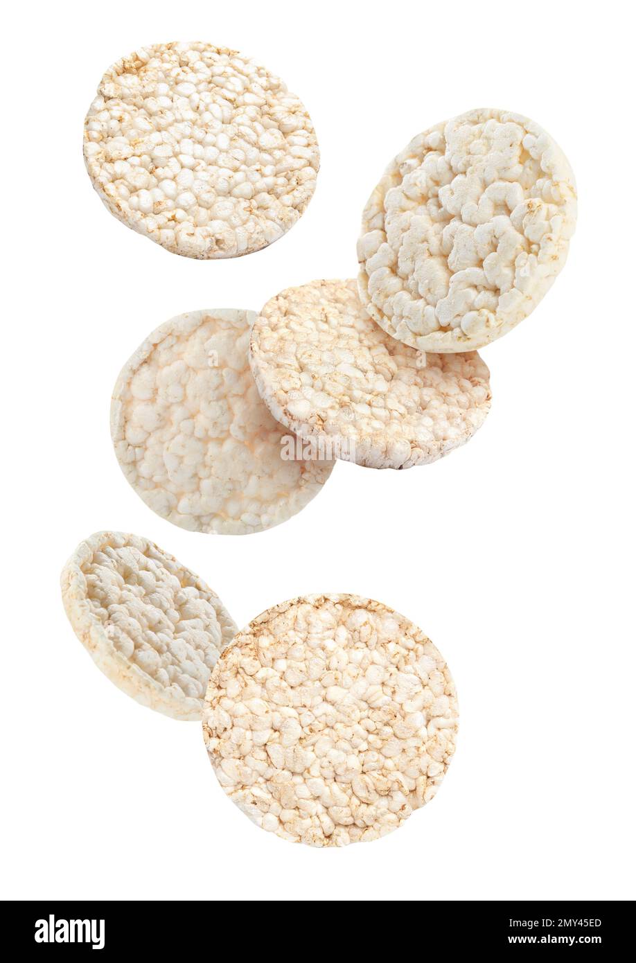 Puffed corn cakes falling on white background Stock Photo - Alamy