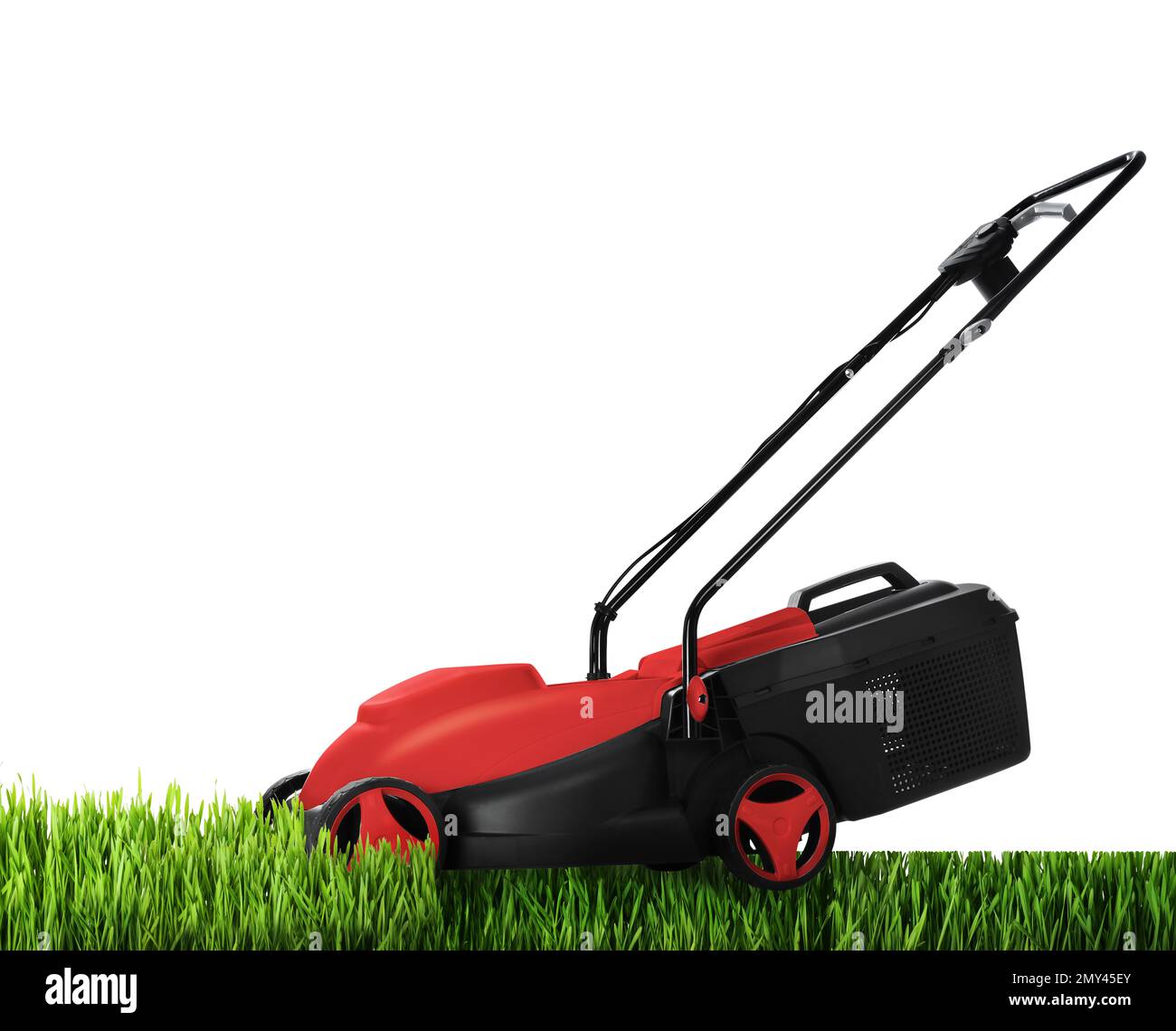 Modern garden lawn mower cutting green grass, white background Stock ...
