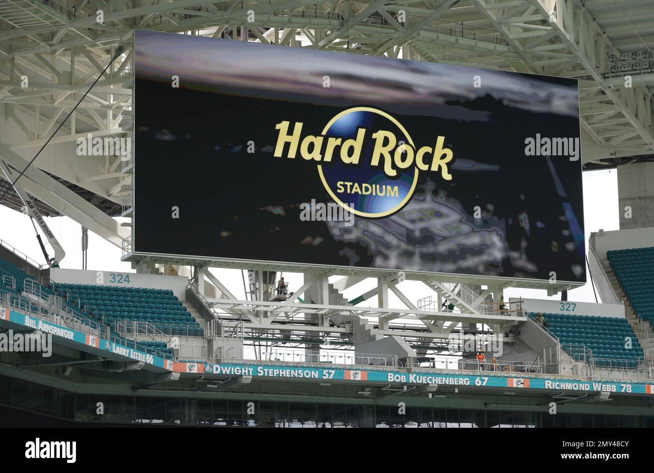 A Hard Rock stadium sign hands in the stands during a ceremony for a ...