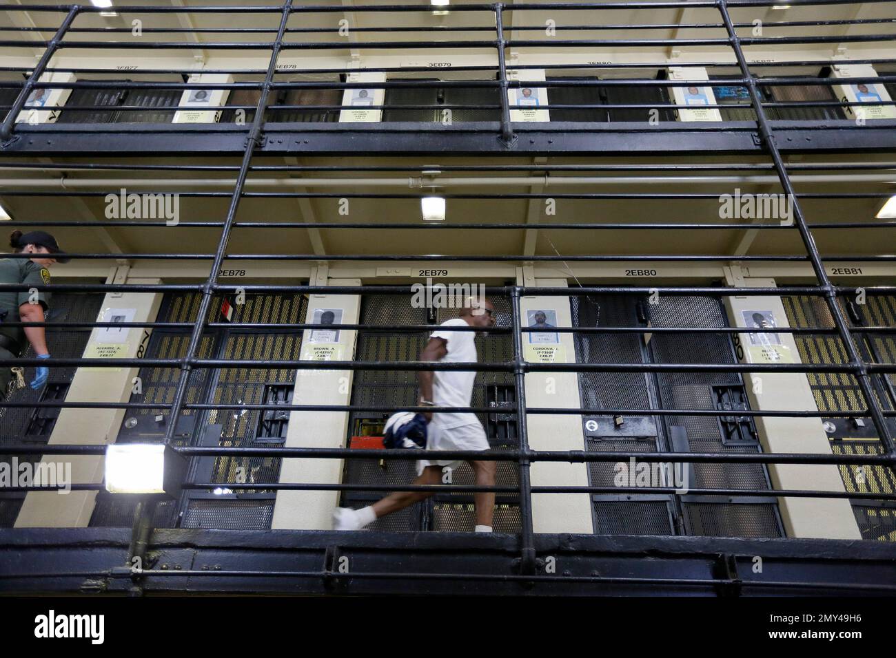 A condemned inmate walks along the east block of death row at San ...