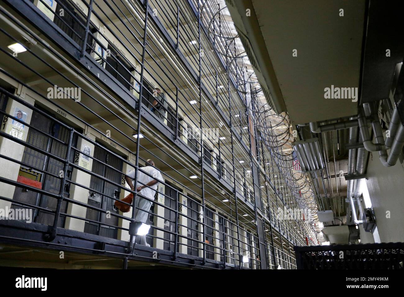 A condemned inmate walks along the east block of death row at San ...
