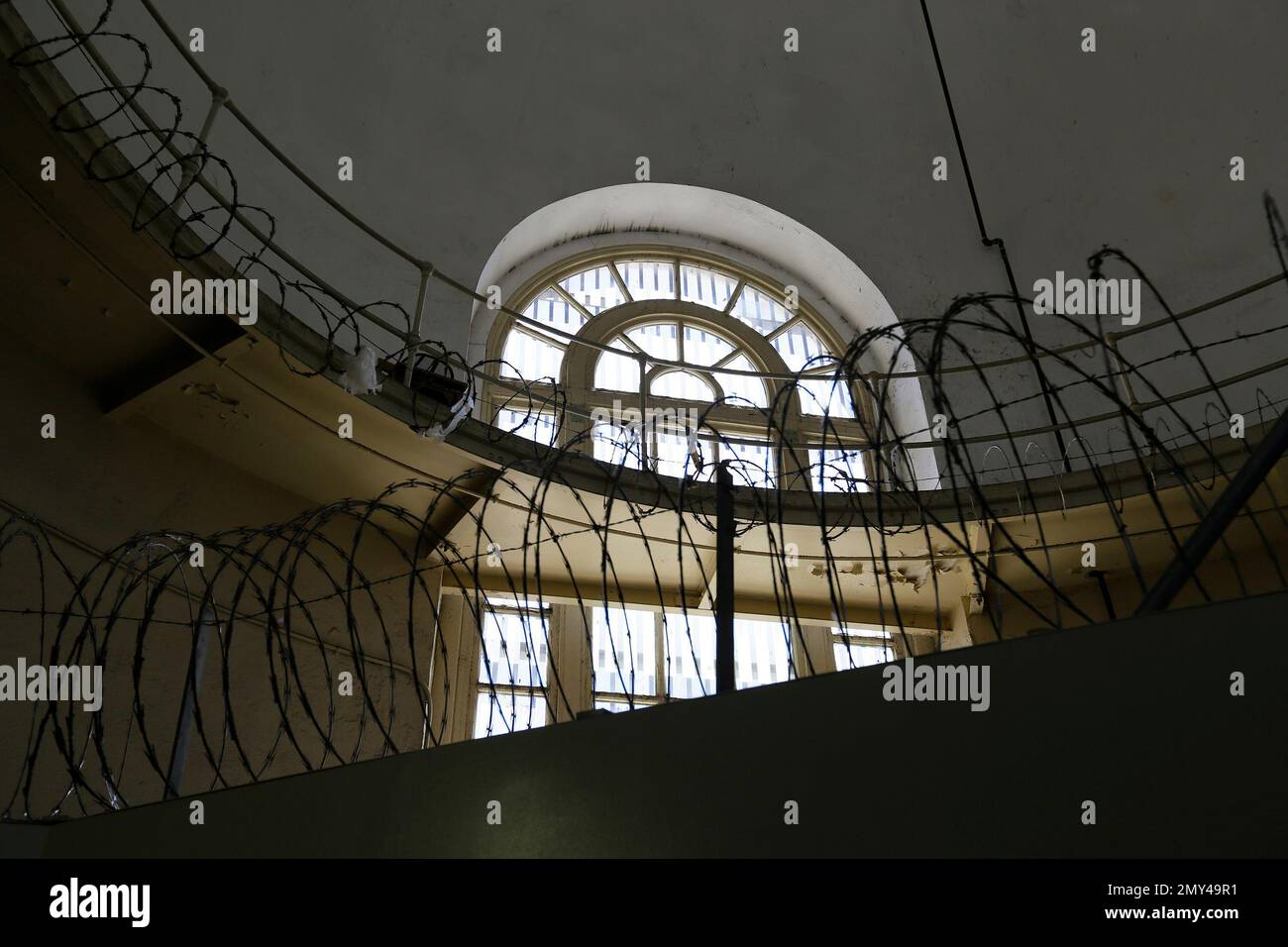Barbed wire is seen inside the entrance to the east block of death row ...