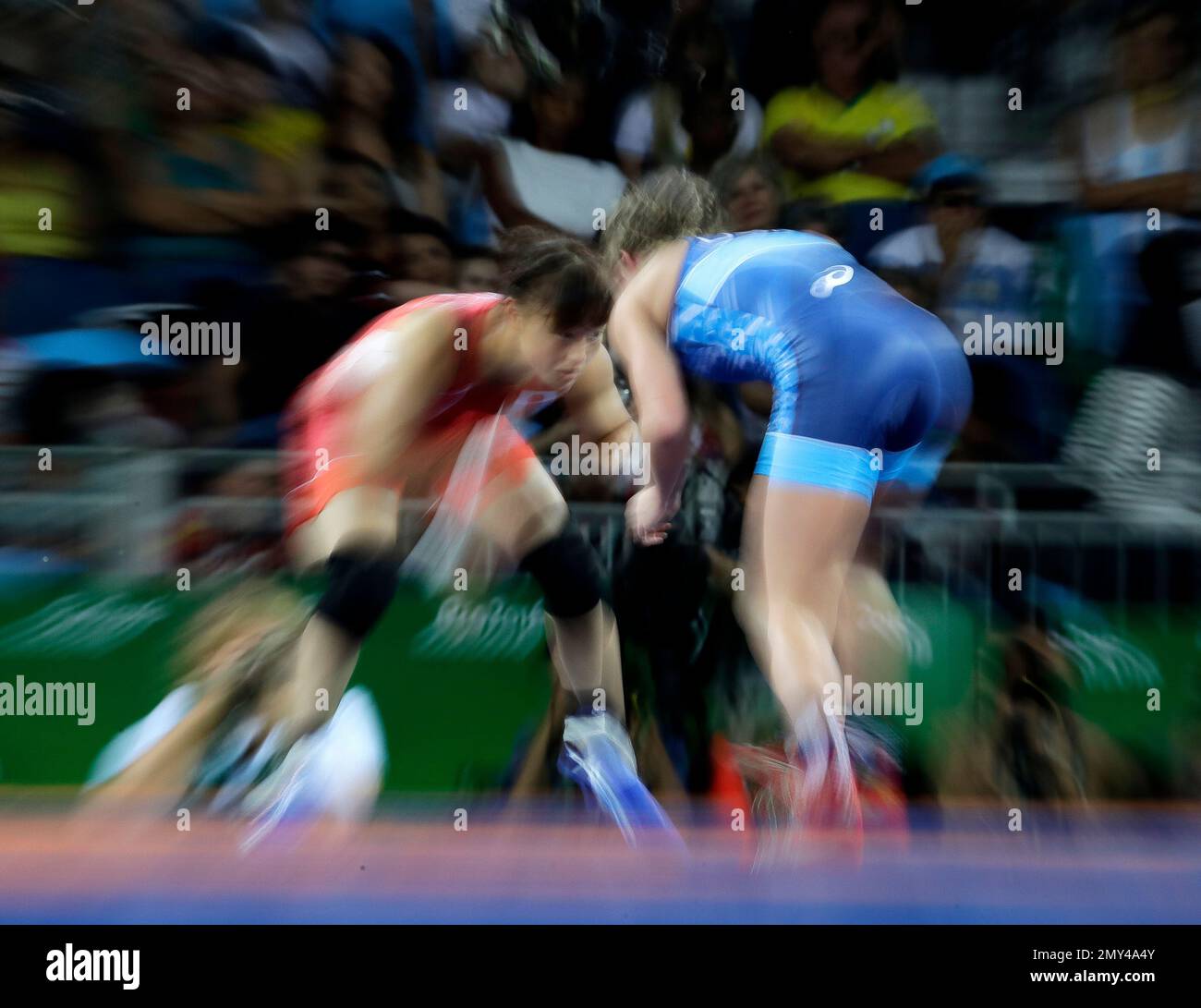 Japan's Eri Tosaka, left, competes against United States' Haley Ruth ...