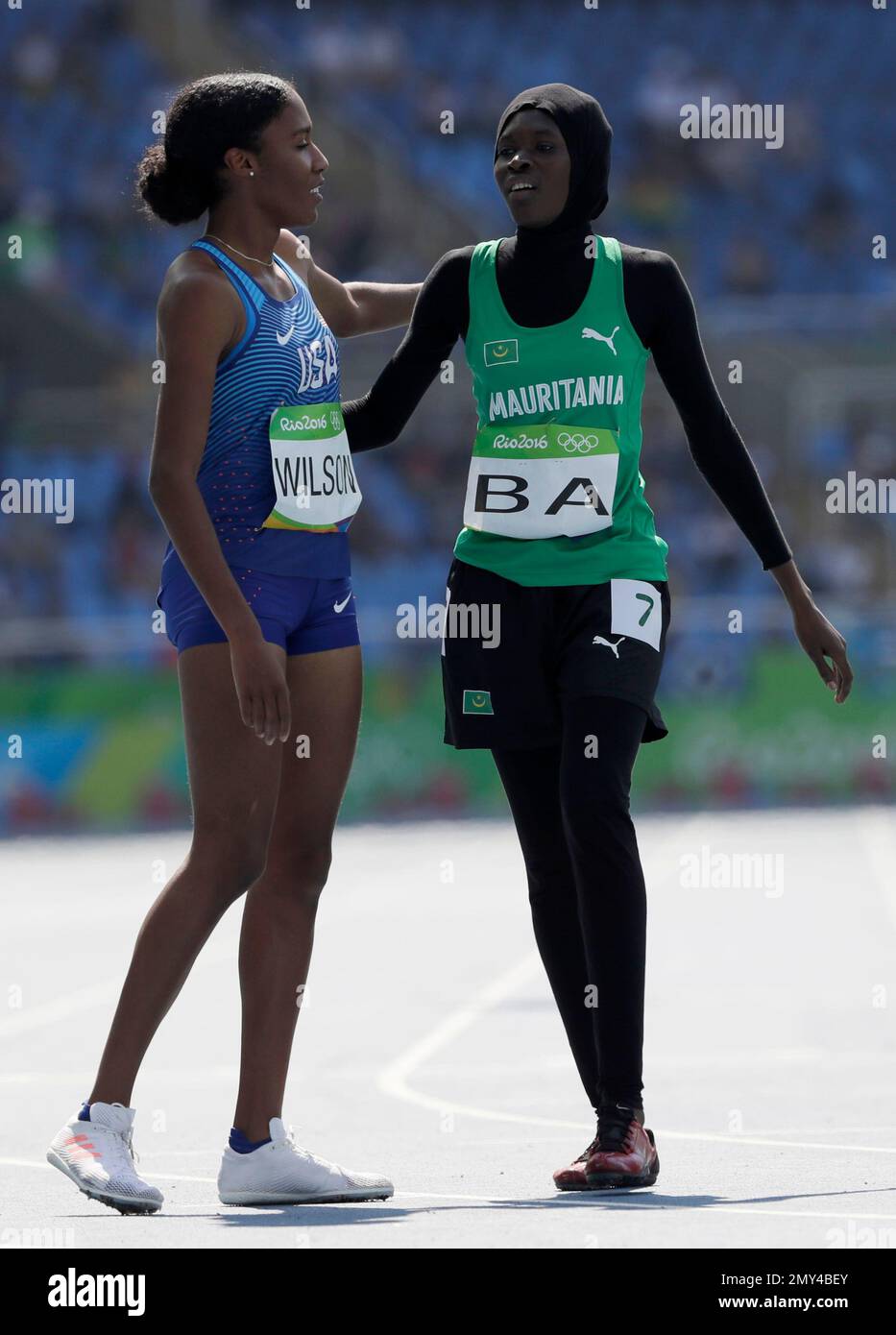 Mauritania's Houleye Ba, right, is greeted by United States' Ajee ...