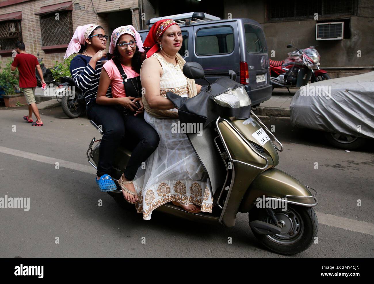 An Indian Parsi family arrives to offer prayers at a fire temple, on ...