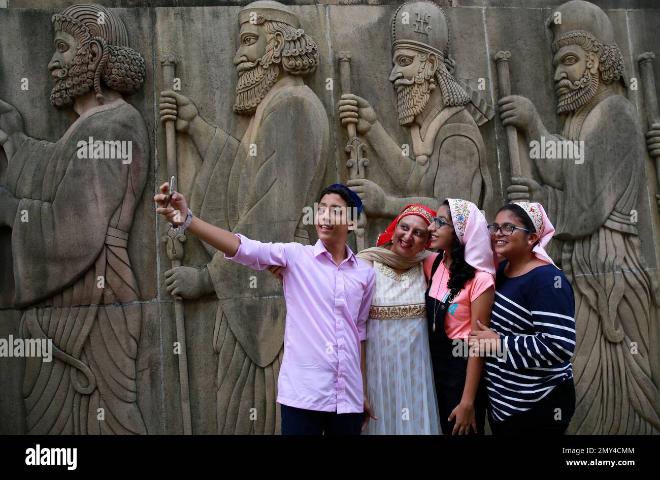 An Indian Parsi family takes a selfie at a fire temple, on occasion of ...