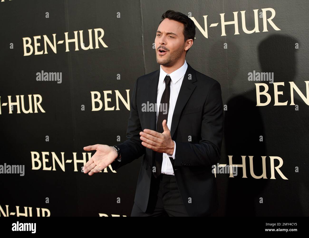 Jack Huston, the star of "Ben-Hur," banters with photographers at the premiere of the film at ...