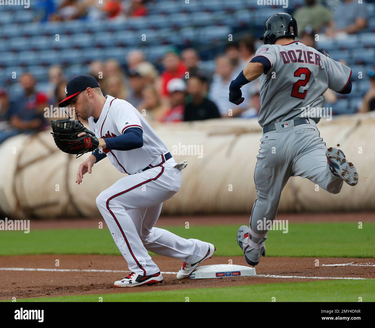 Minnesota Twins' Brian Dozier (2) is forced out at first base by ...