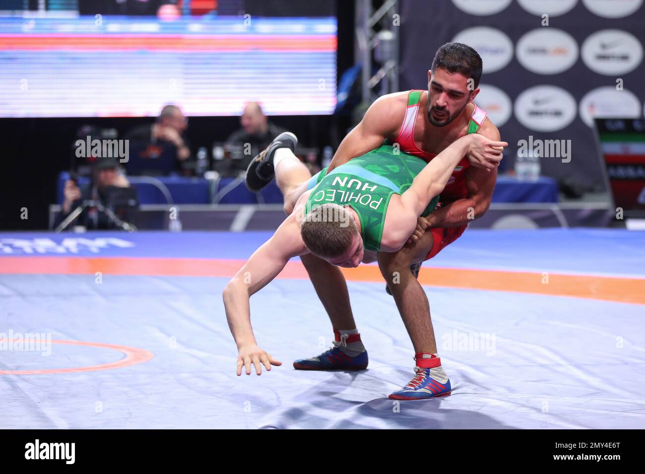 ZAGREB, CROATIA – FEBRUARY 04: Reza Mahdi Abbasi of Iran (red) competes ...