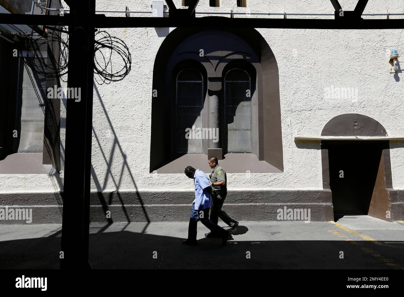 A condemned inmate is led back to his cell on death row at San Quentin ...