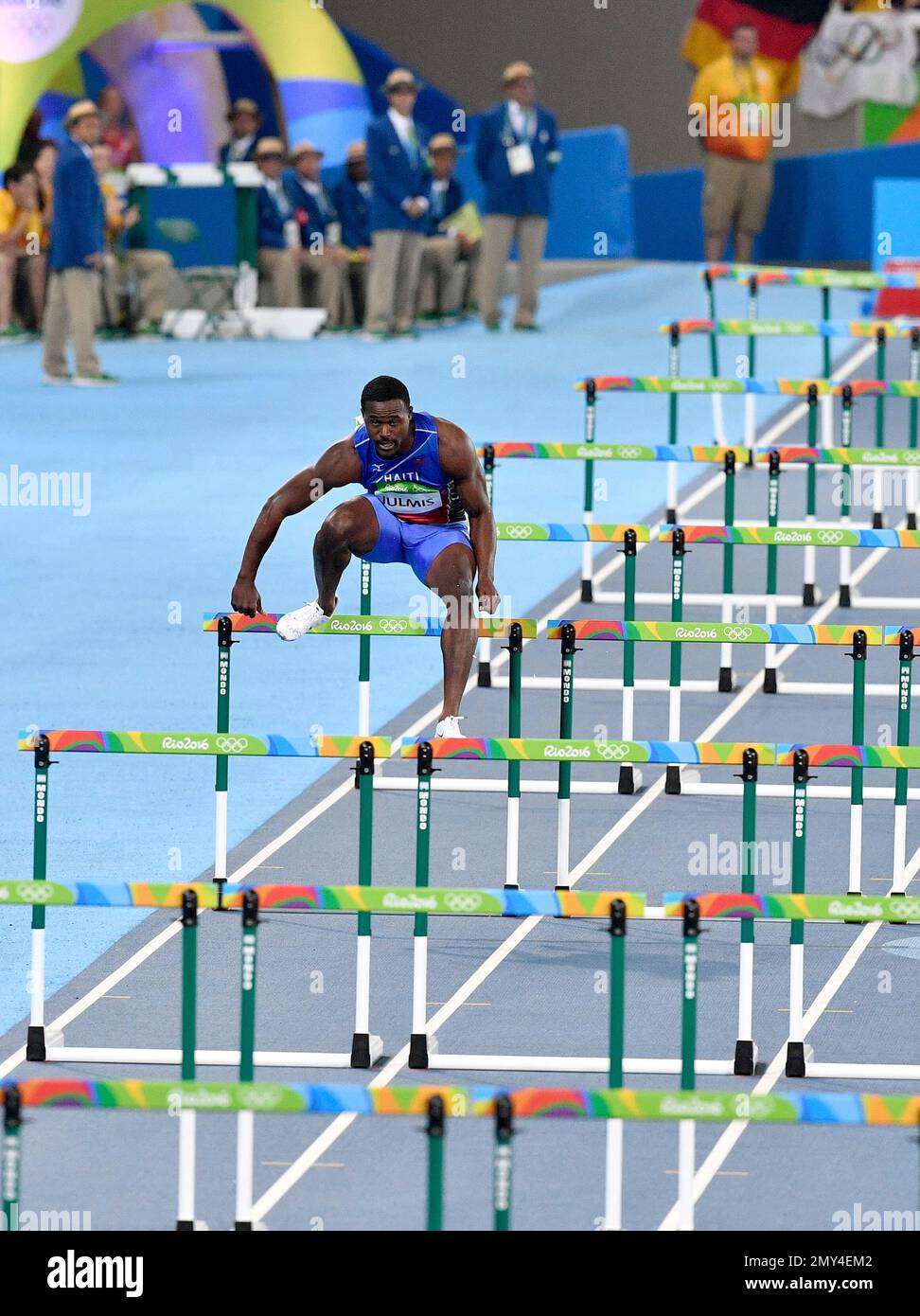 Haiti's Jeffrey Julmis completes the men's 110-meter hurdles semifinal ...
