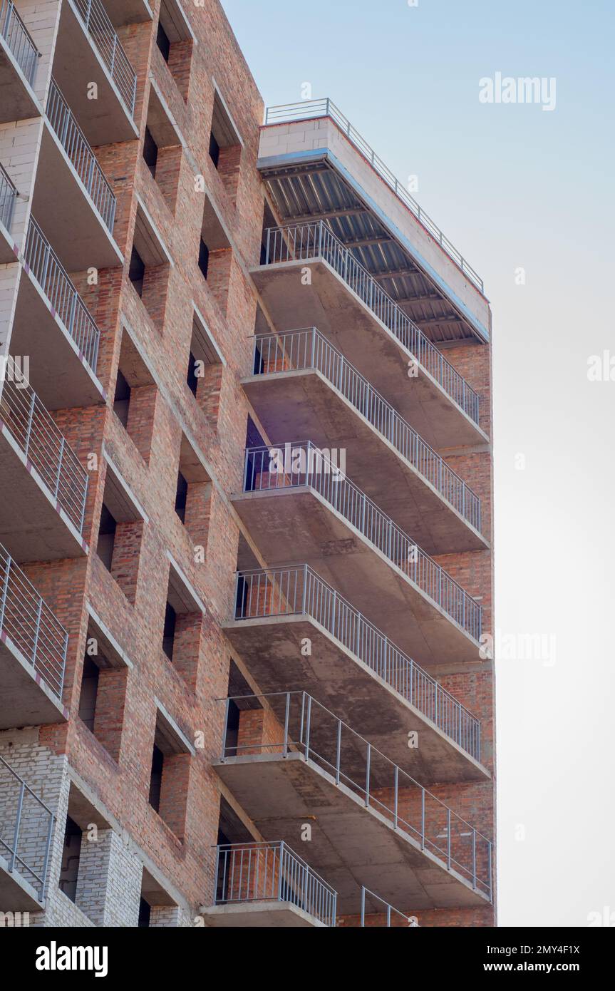 A residential multi-storey building under construction, a fragment of a ...