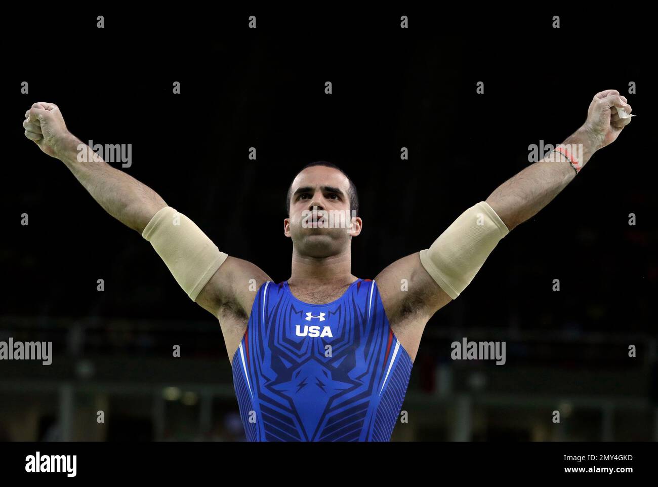 United States' Danell Leyva completes his routine on the parallel bars ...