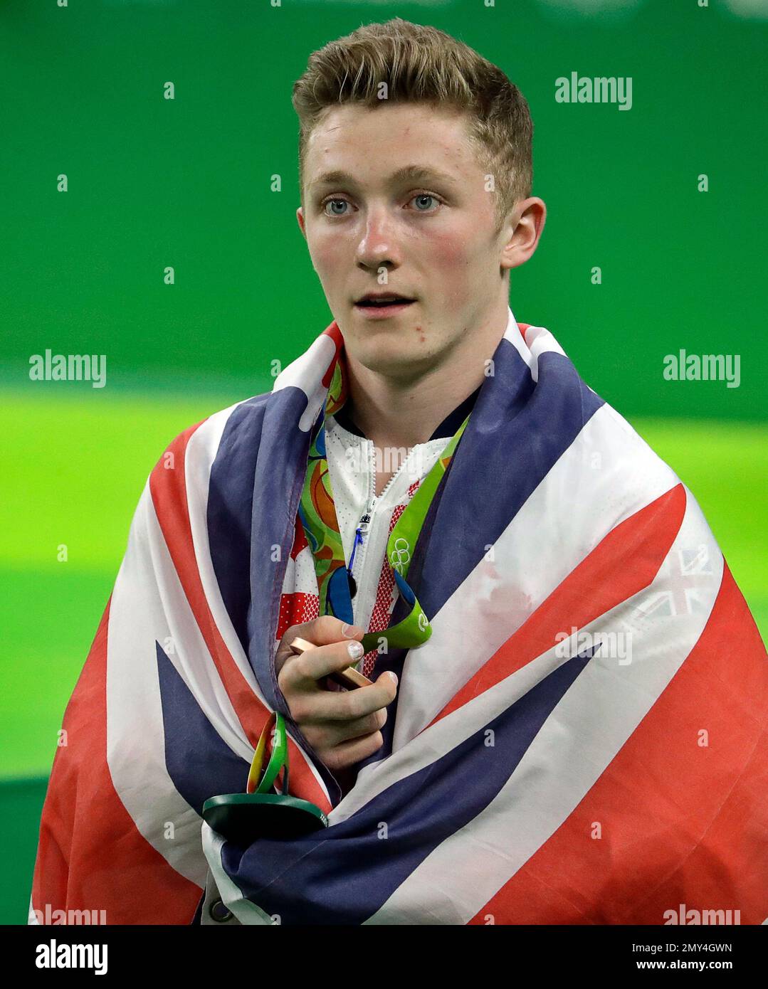 Britain's Nile Wilson holds his bronze medal for the horizontal bar ...