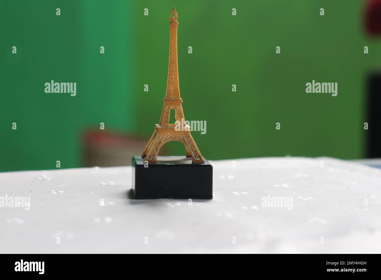 The miniature Eiffel tower is made of ceramic, which is very famous in ...