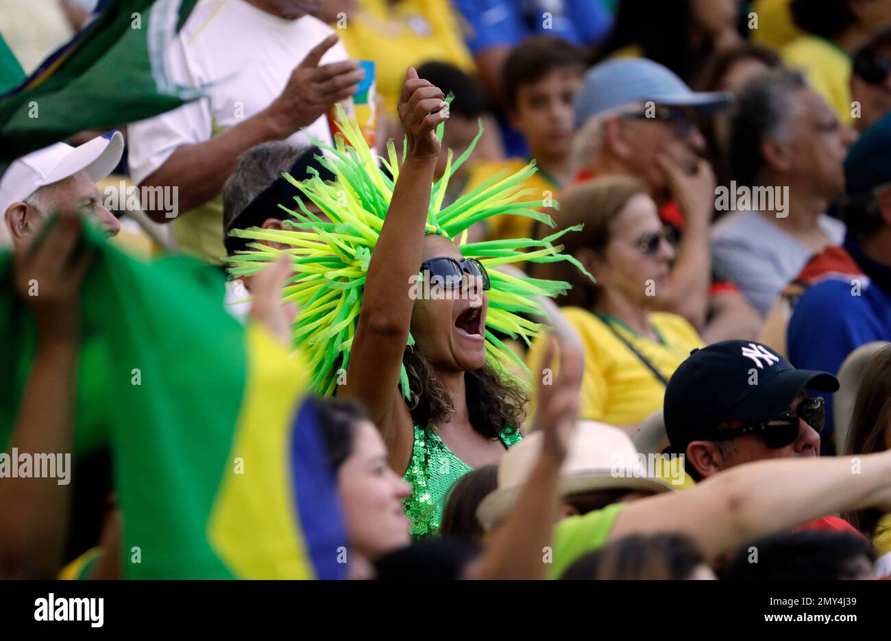Spectators cheer during a semi-final match of the women's Olympic ...