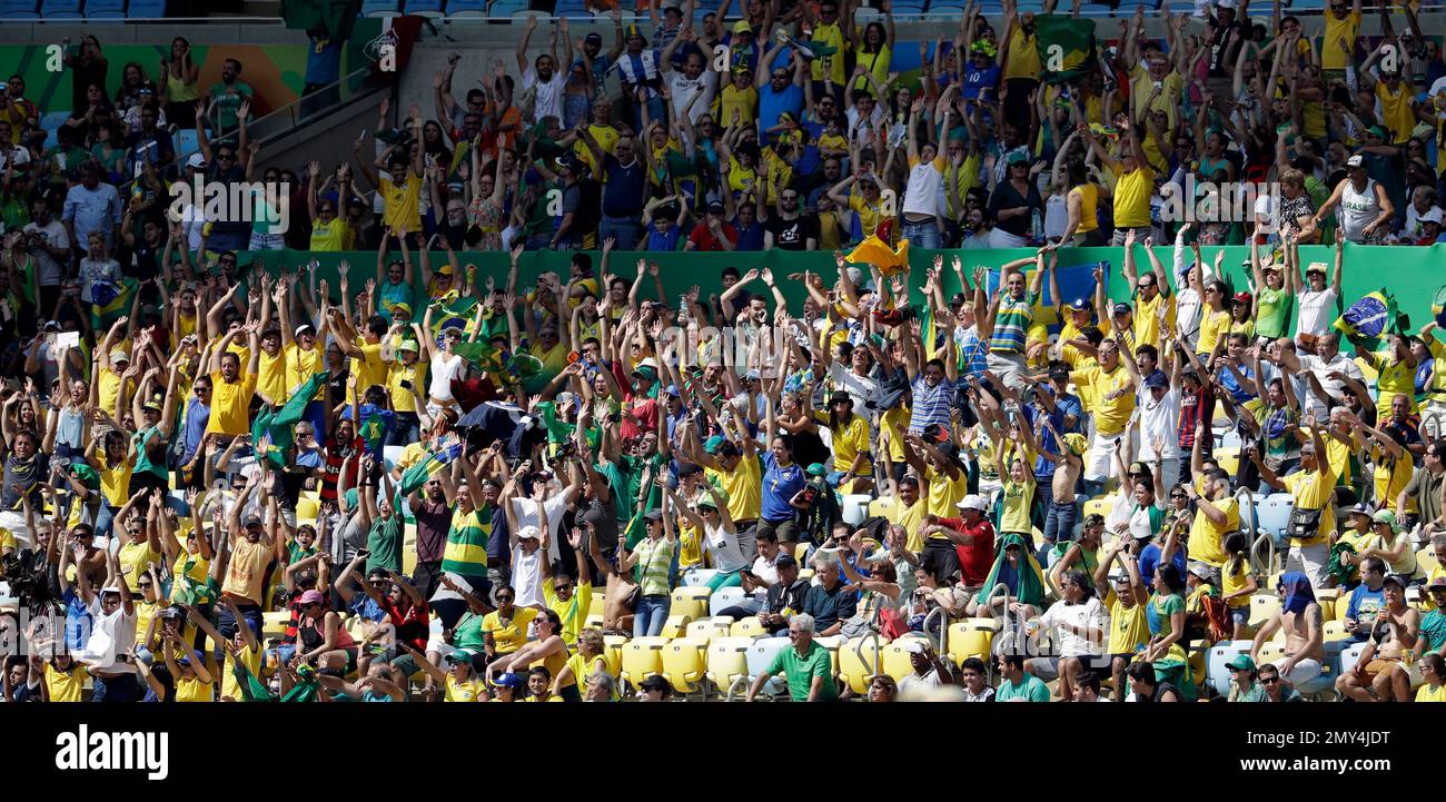 Spectators cheer during a semi-final match of the women's Olympic ...