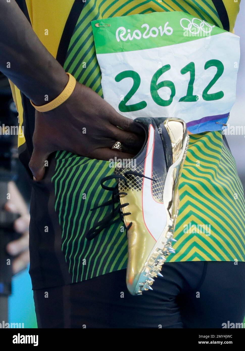 Jamaica's Usain Bolt holds his shoe after winning a men's 200-meter ...