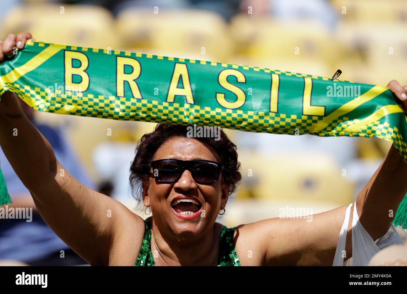 A fan cheers before a semi-final match of the women's Olympic football ...