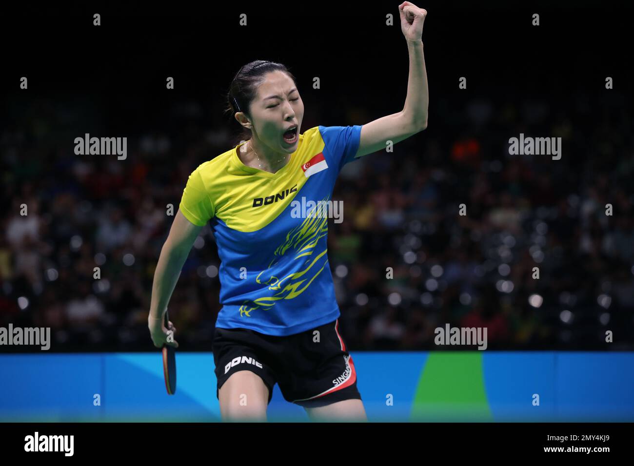 Yu Mengyu of Singapore celebrates a winning point Ai Fukuhara of Japan ...