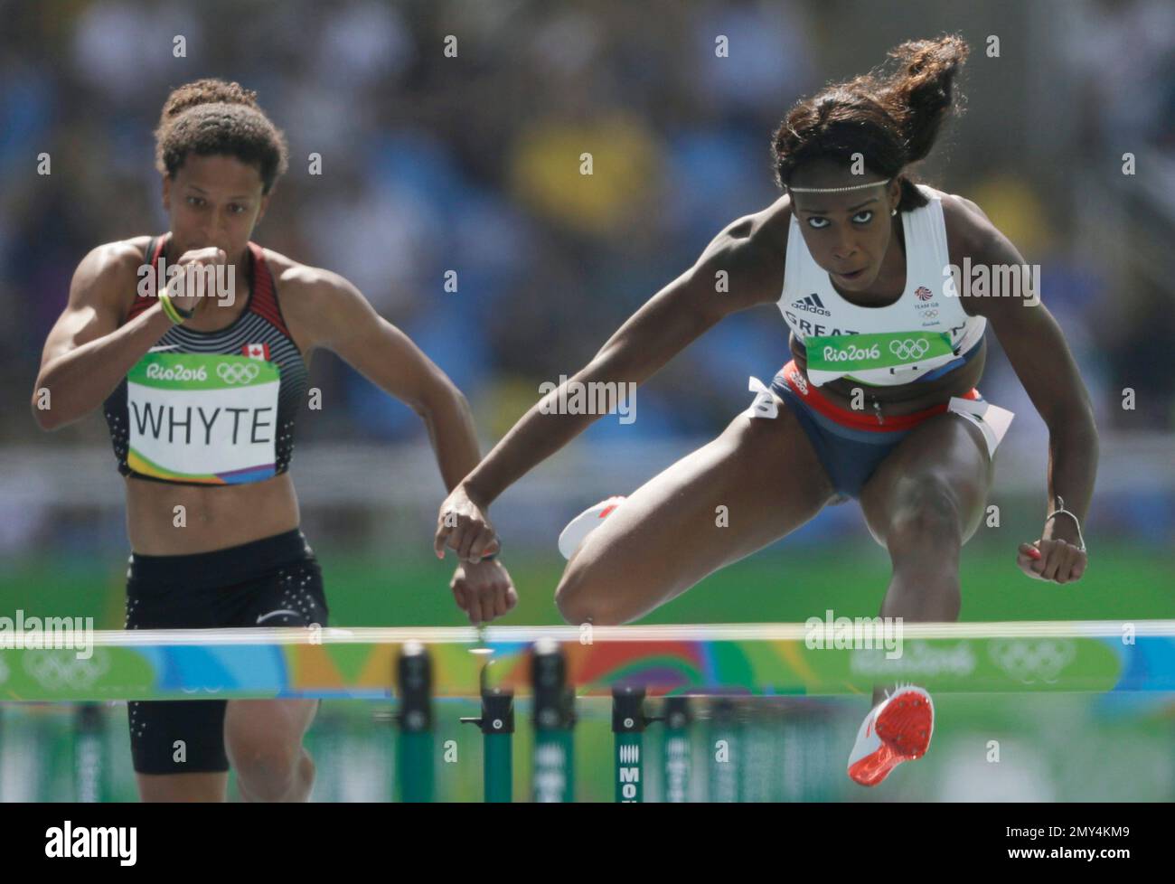 Britain's Cindy Ofili, right, and Canada's Angela Whyte compete in a ...