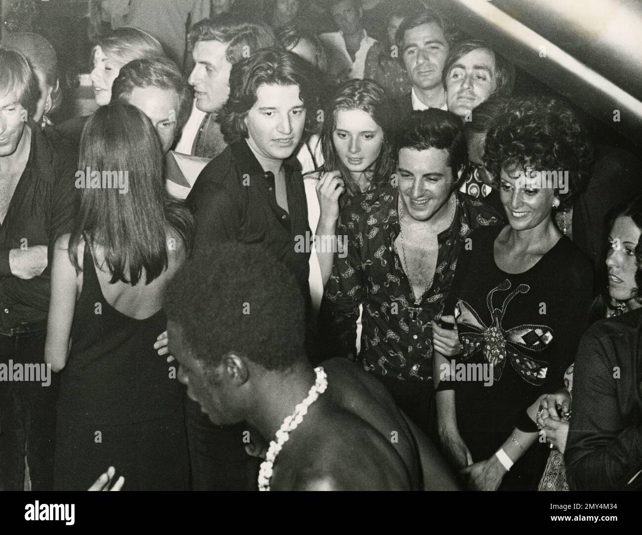 Italian film actor Christian De Sica in a disco, Rome, Italy 1970s ...