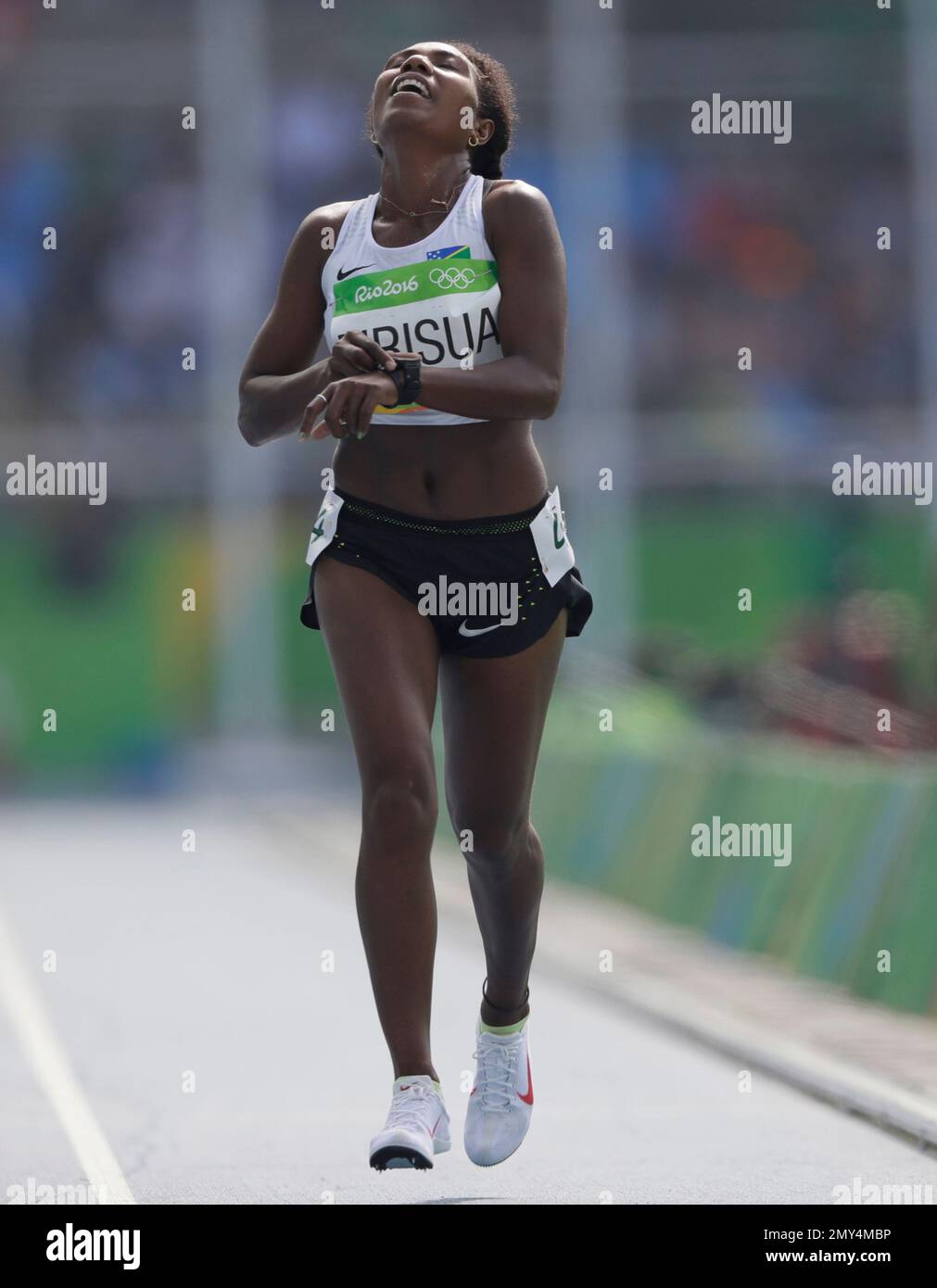 Solomon Islands 's Sharon Firisua competes in a women's 5000-meter heat ...
