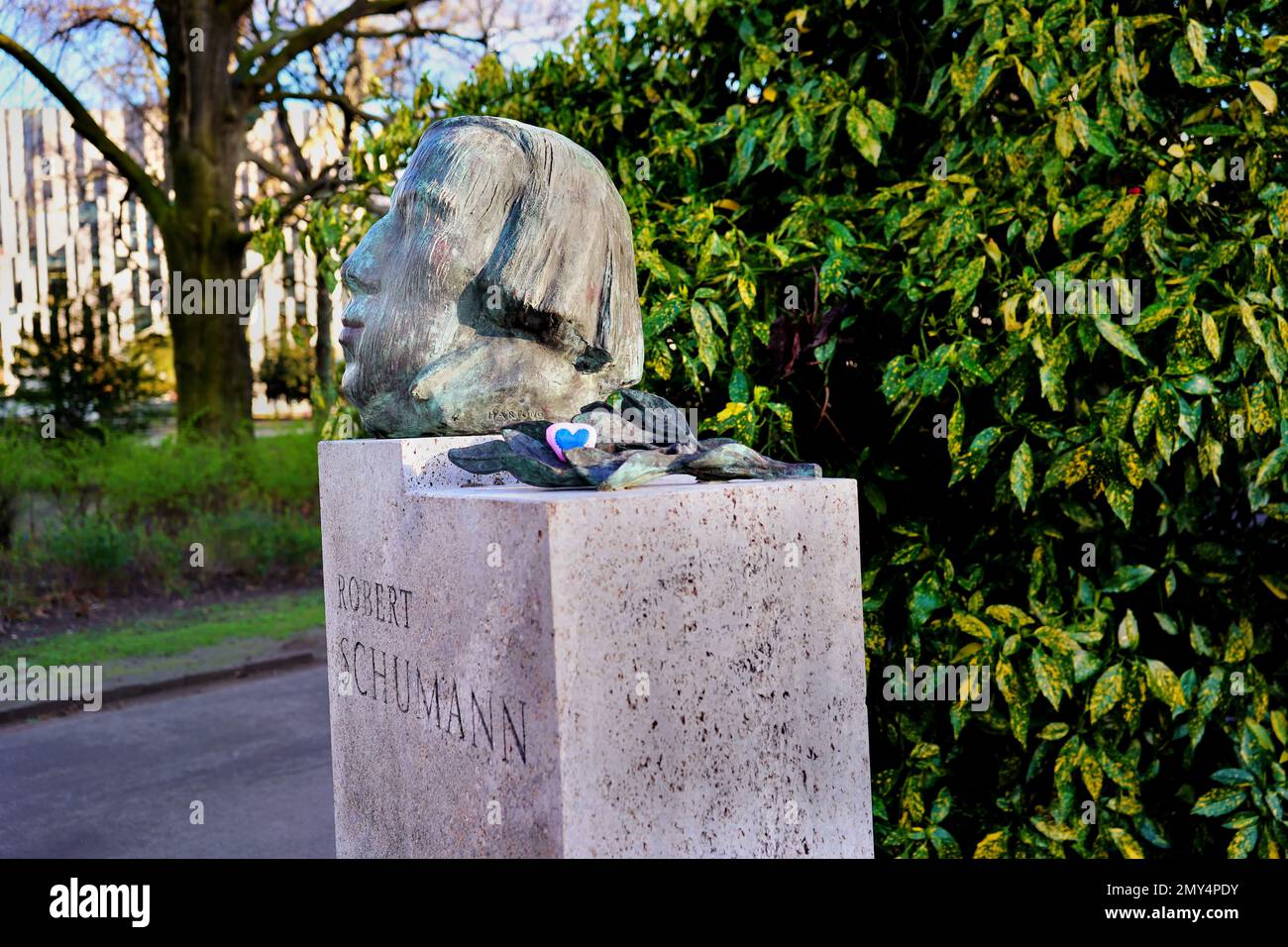 Bronze bust of the German composer Robert Schumann in the public park ...