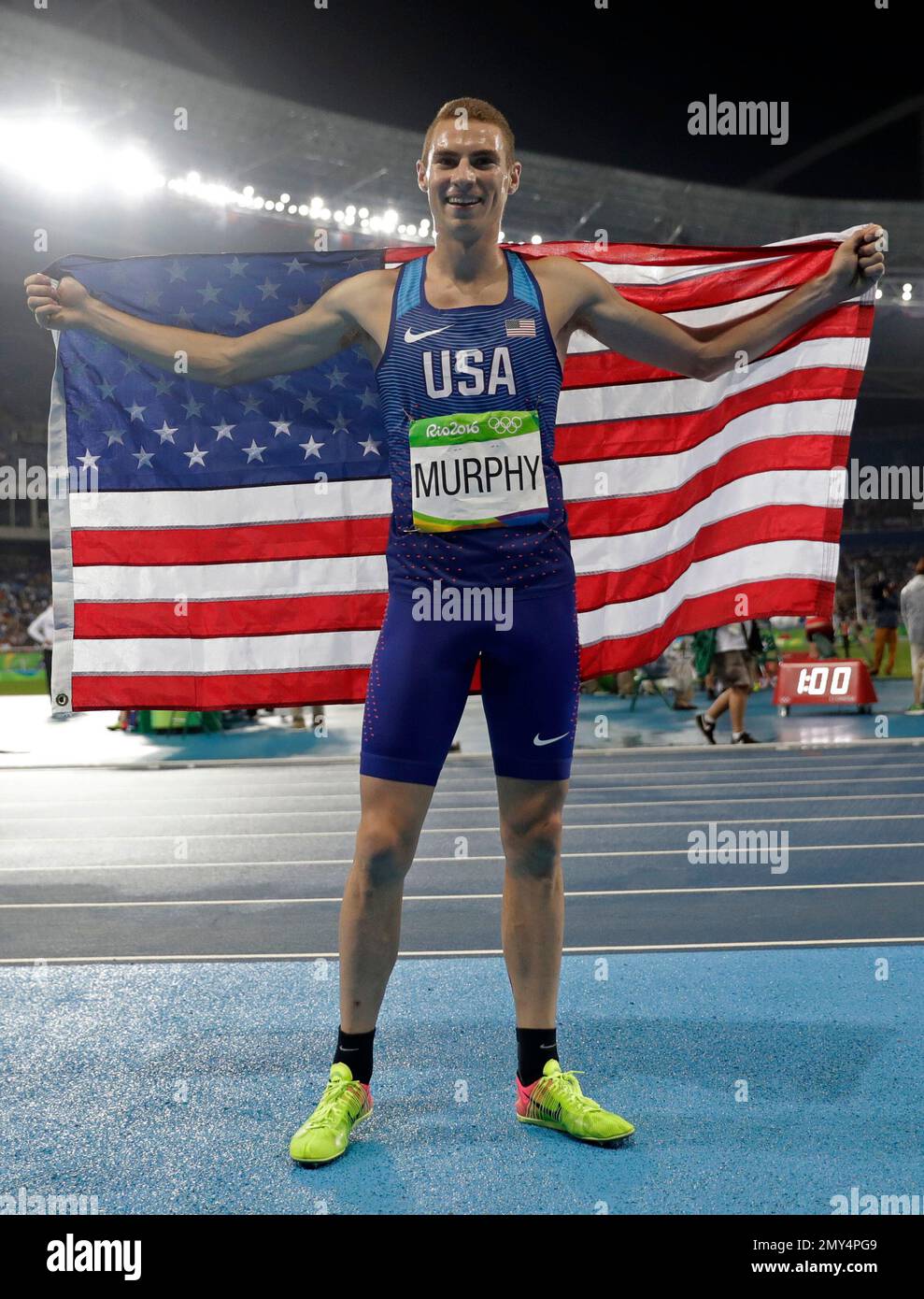 United States' Clayton Murphy poses with the U.S. flag after winning ...