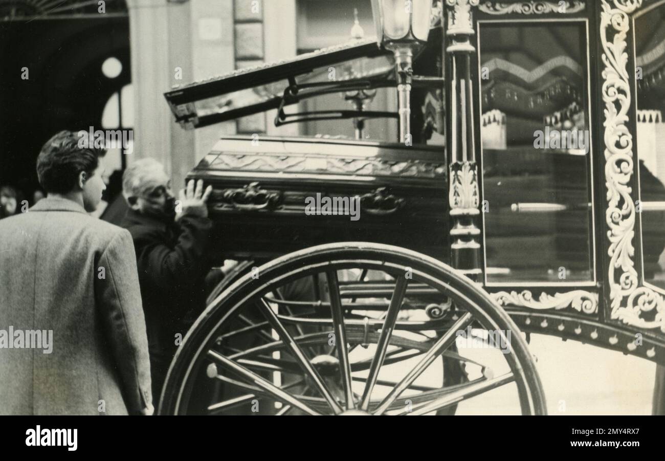 Traditional Italian catholic church funeral with wagon, procession and ...