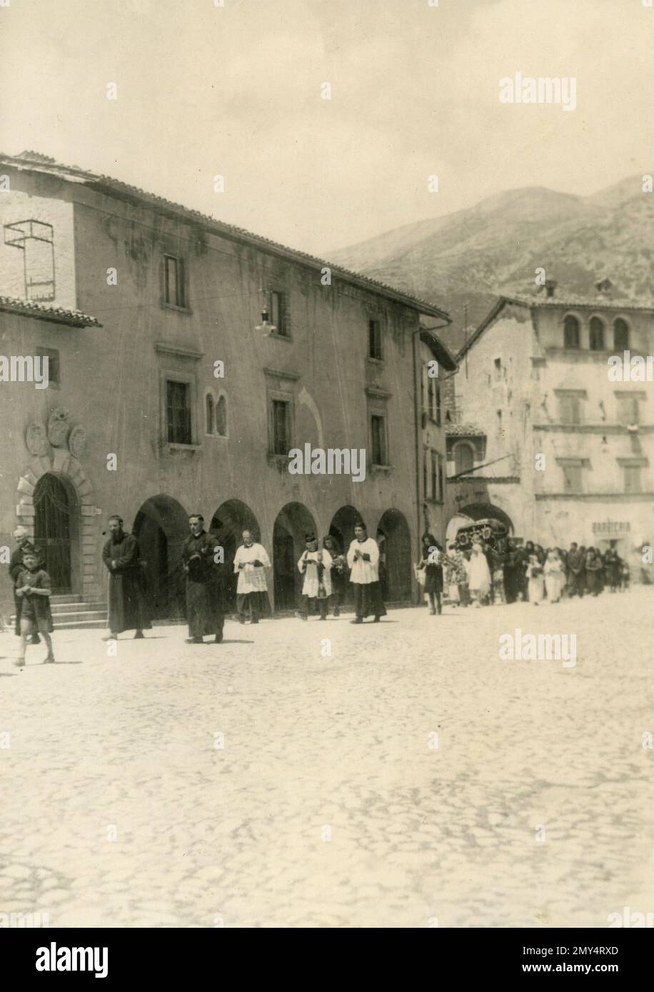 Procession with altar boys and wagon at a funeral, Italy 1930s Stock ...